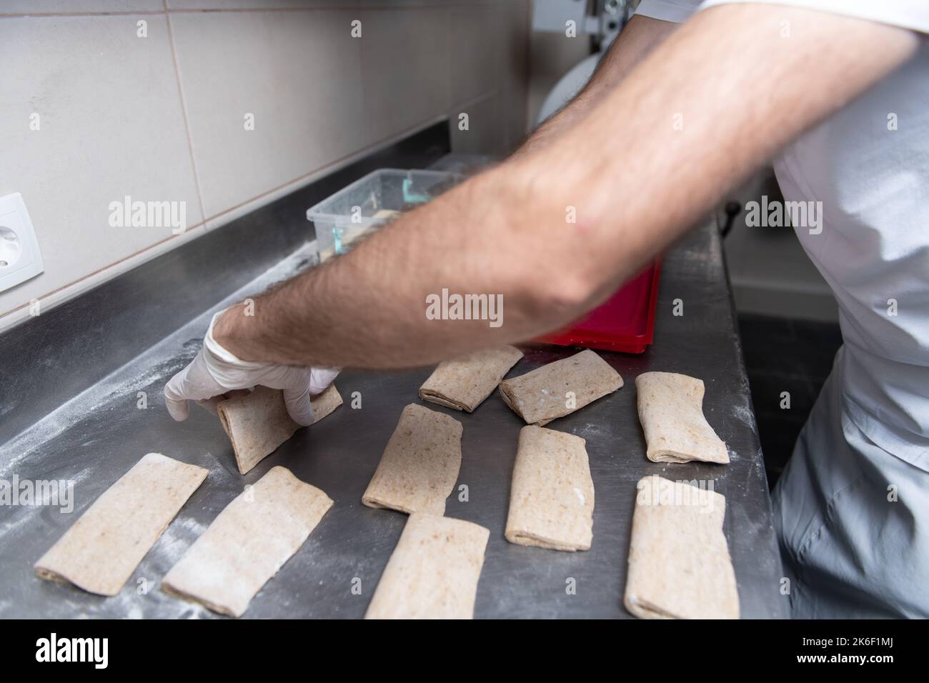Young Pastry Chef Making Some Sweet Snack in the Bakery Cooking Process ...