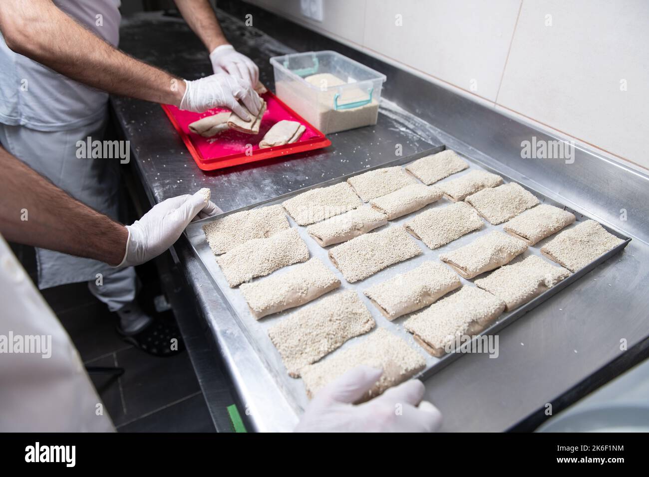 Young Pastry Chef Making Some Sweet Snack in the Bakery Cooking Process ...