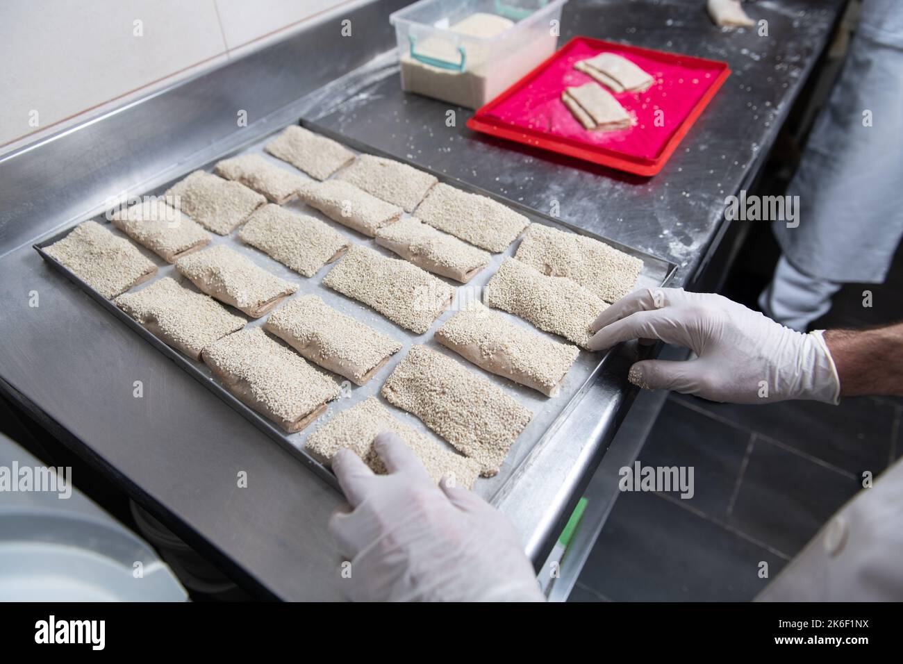 Young Pastry Chef Making Some Sweet Snack in the Bakery Cooking Process ...