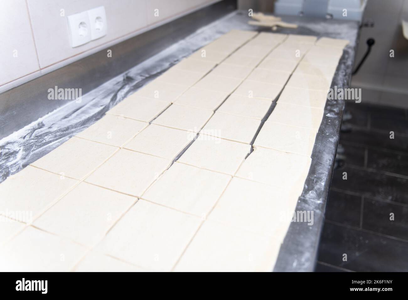 Young Pastry Chef Making Some Croissant in the Bakery Cooking Process ...