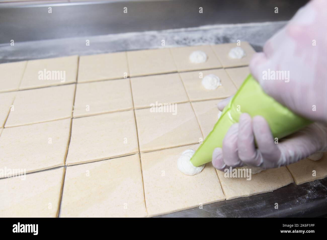 Young Pastry Chef Making Some Cheese Croissant in the Bakery Cooking ...