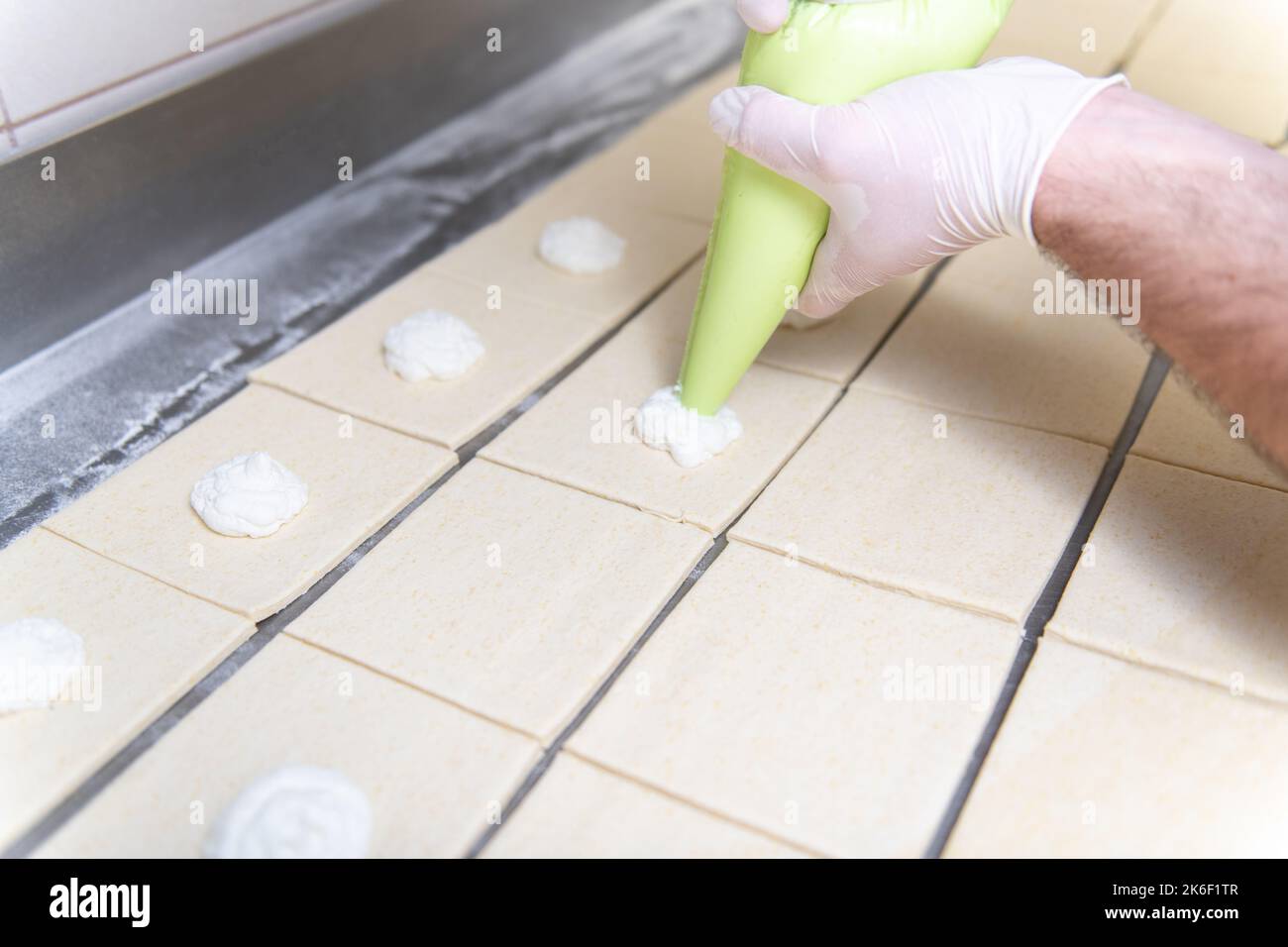 Young Pastry Chef Making Some Cheese Croissant in the Bakery Cooking ...