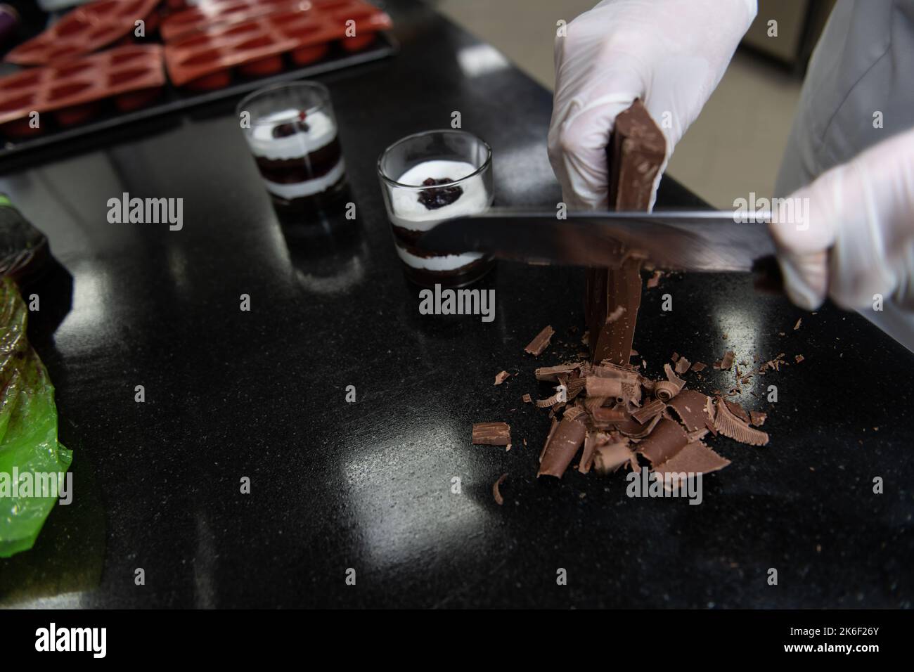 Chocolate Chef is Using Knife Chop Dark Chocolate Bars to Into Small ...