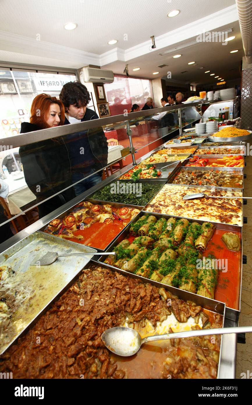 ISTANBUL, TURKEY - JUNE 14: Couple looking at traditional Turkish foods ...