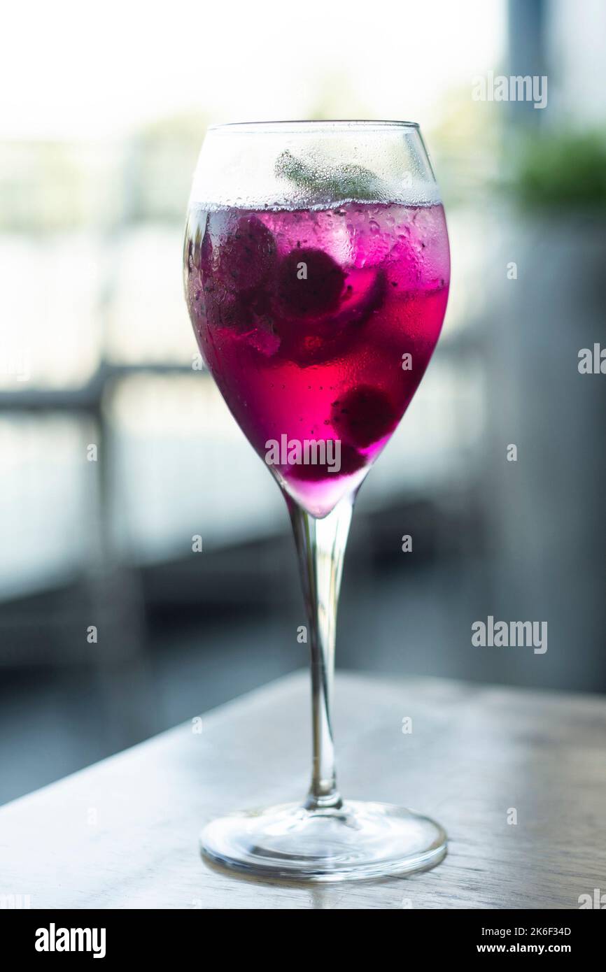 raspberry and red dragon fruit prosecco wine spritzer cocktail Stock ...