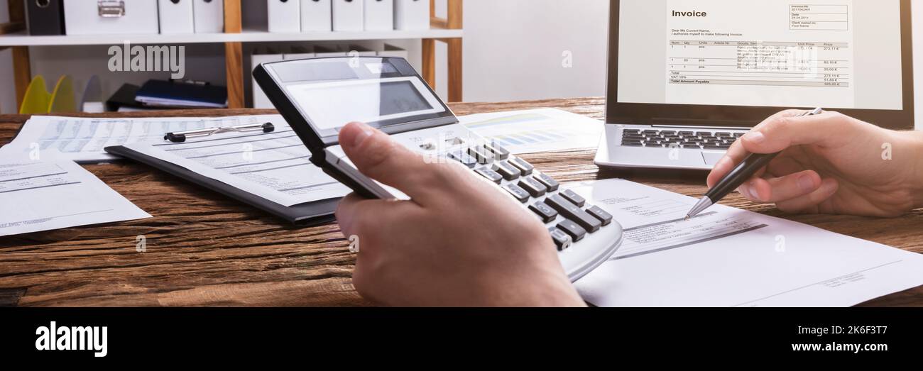 Tax Accountant Calculate Finance Invoice Bill At Desk Stock Photo - Alamy