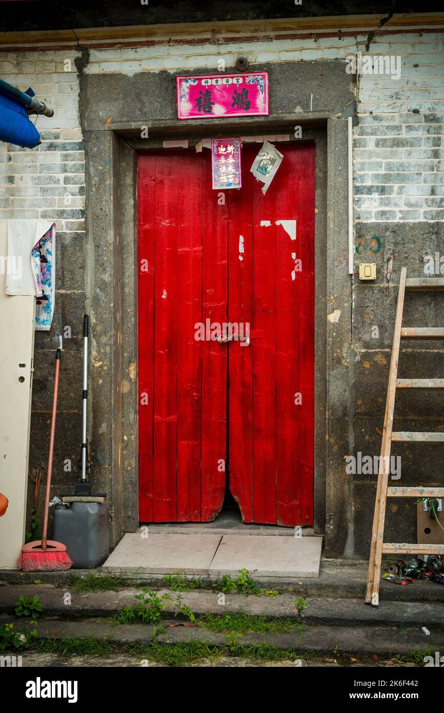 Entrance to a simple Chinese village temple showing traditional ...