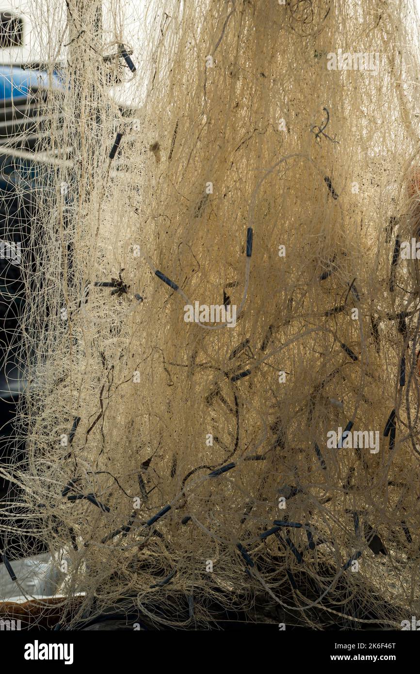 Fishing net hung up to dry at a pearl oyster farm in Lo Fu Wat, a ...