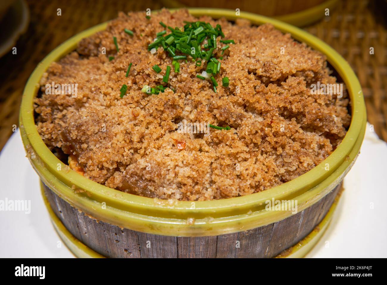 A delicious traditional Guilin dish, steamed pork with rice powder ...