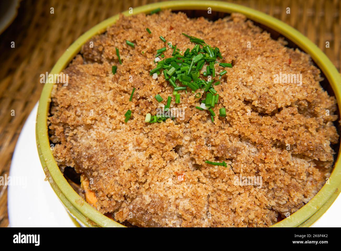 A delicious traditional Guilin dish, steamed pork with rice powder ...