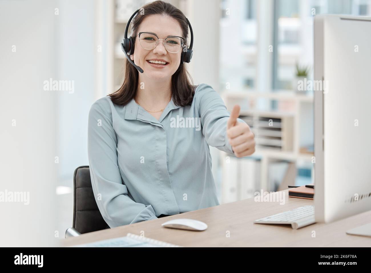 Sales woman, thumbs up success and telemarketing call center, happy ...