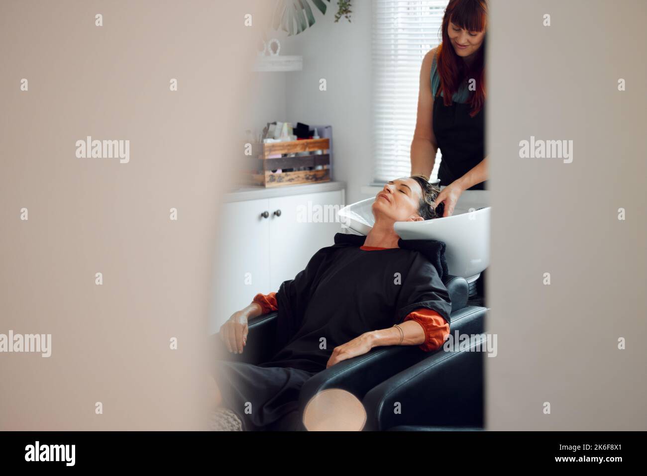 Beauty salon, woman customer and washing hair service, luxury shampoo ...