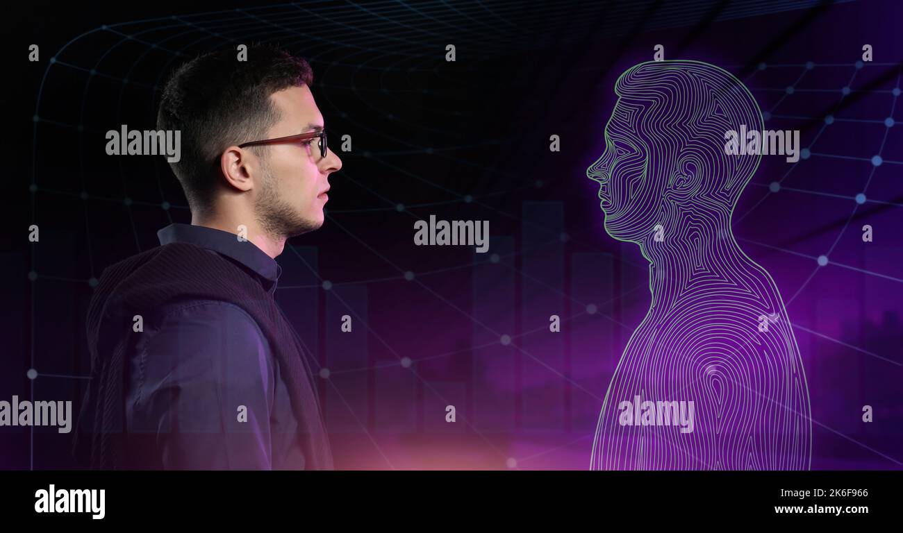 Young man with his digital projection on dark background. Concept of ...