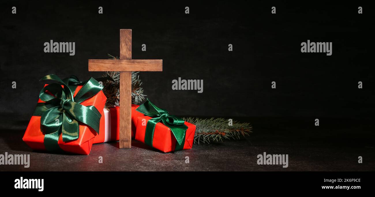 Cross and gifts on dark background with space for text. Concept of ...