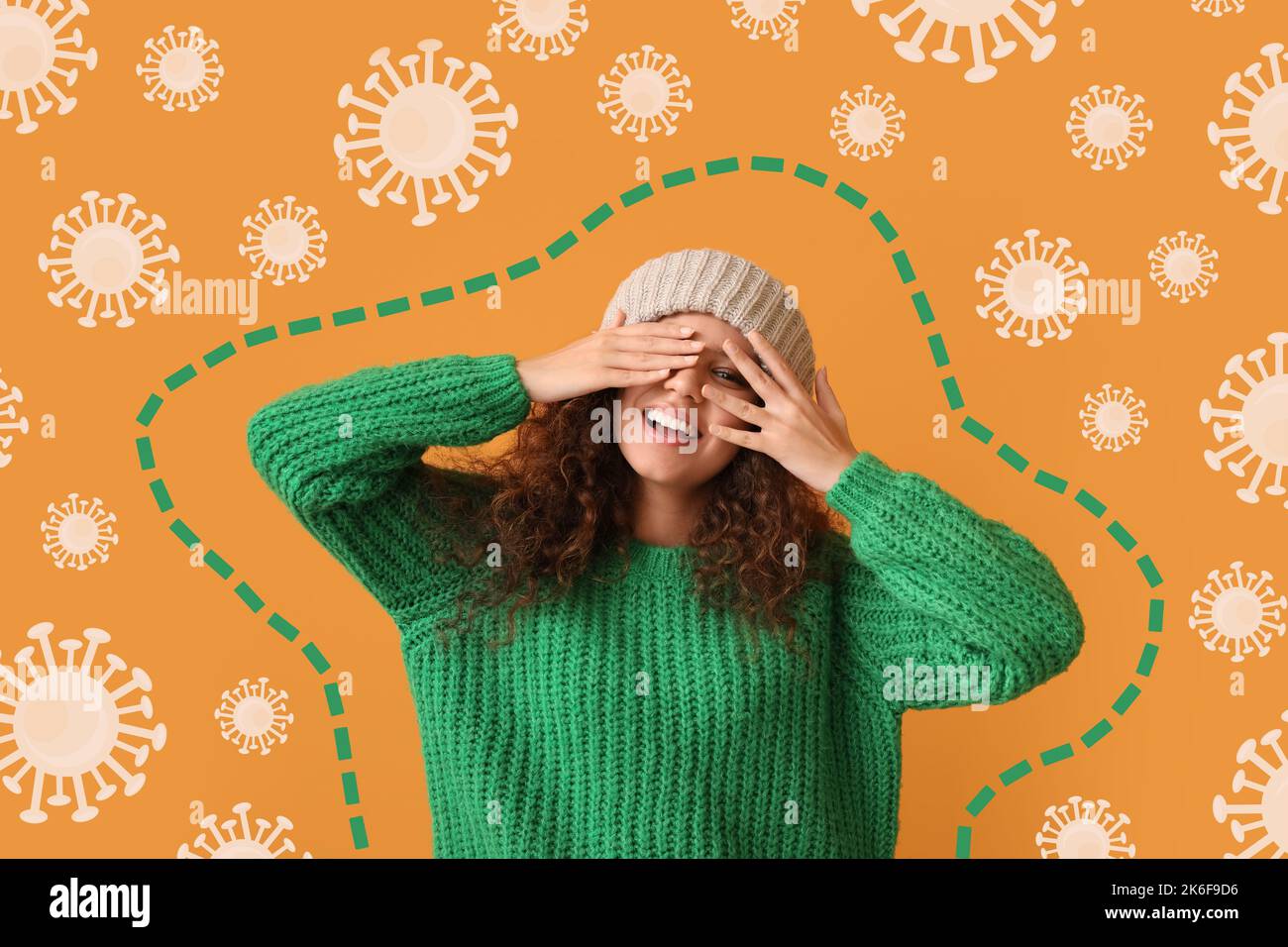 Happy young African-American woman and drawn virus on orange background ...