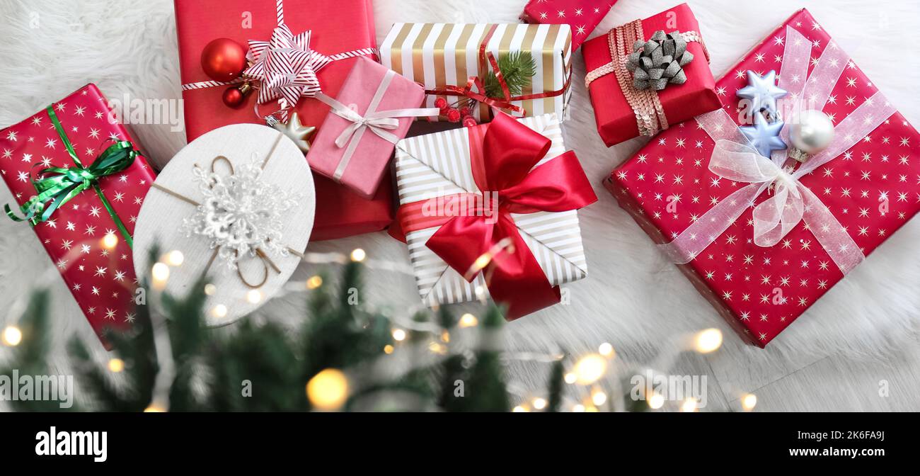 Many gift boxes under Christmas tree, top view Stock Photo - Alamy