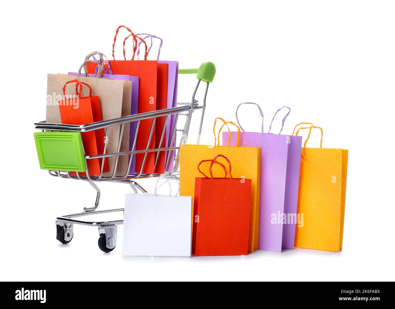 Shopping cart with different paper bags on white background Stock Photo ...
