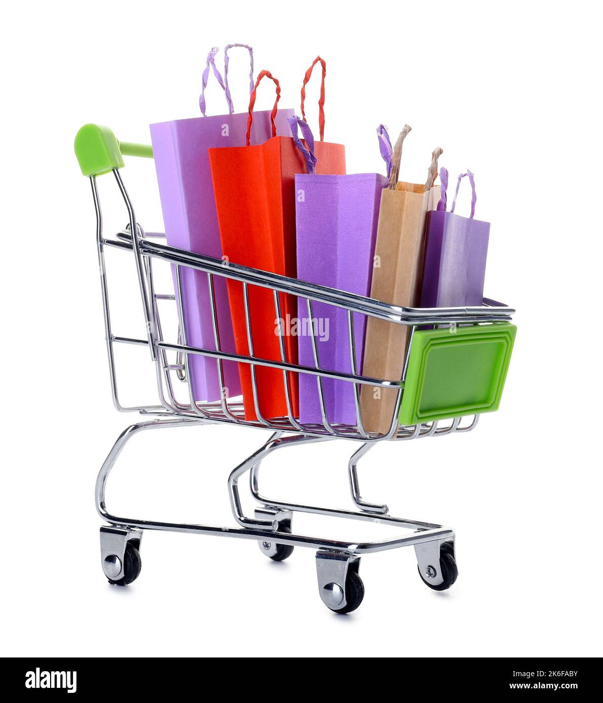 Shopping cart with paper bags on white background Stock Photo - Alamy