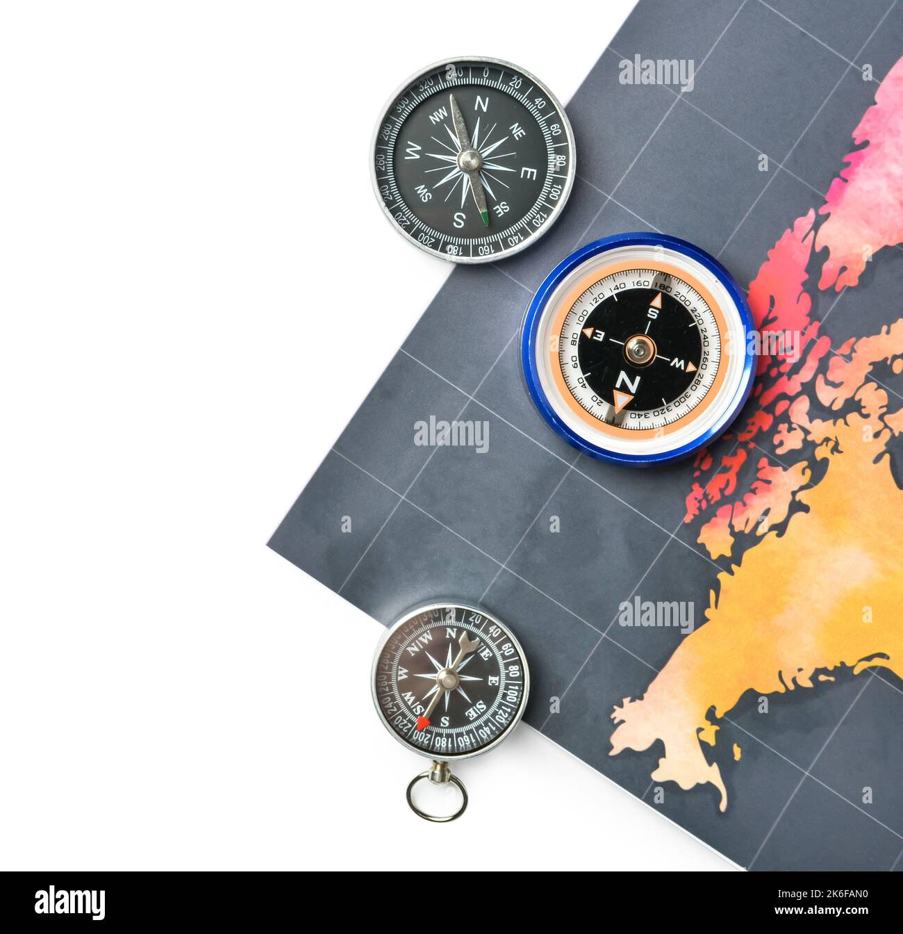Vintage compasses and world map on white background, closeup Stock ...