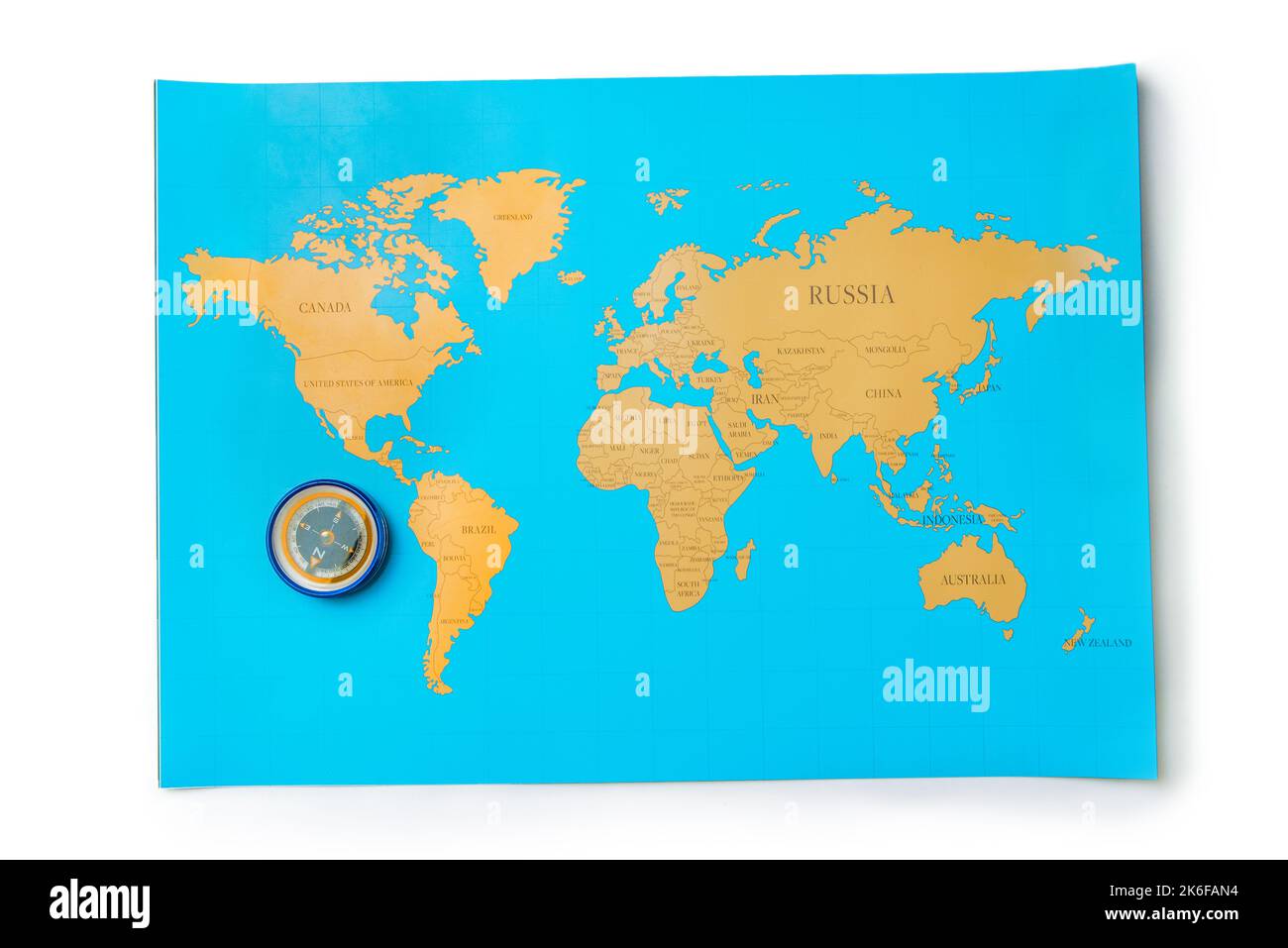 Compass and world map isolated on white background Stock Photo - Alamy