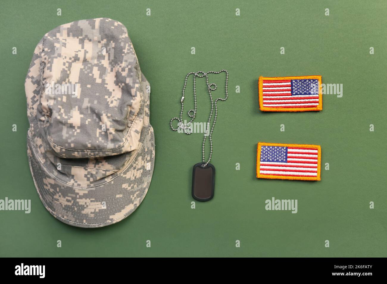 Military cap, tag and chevrons of USA army on green background Stock ...