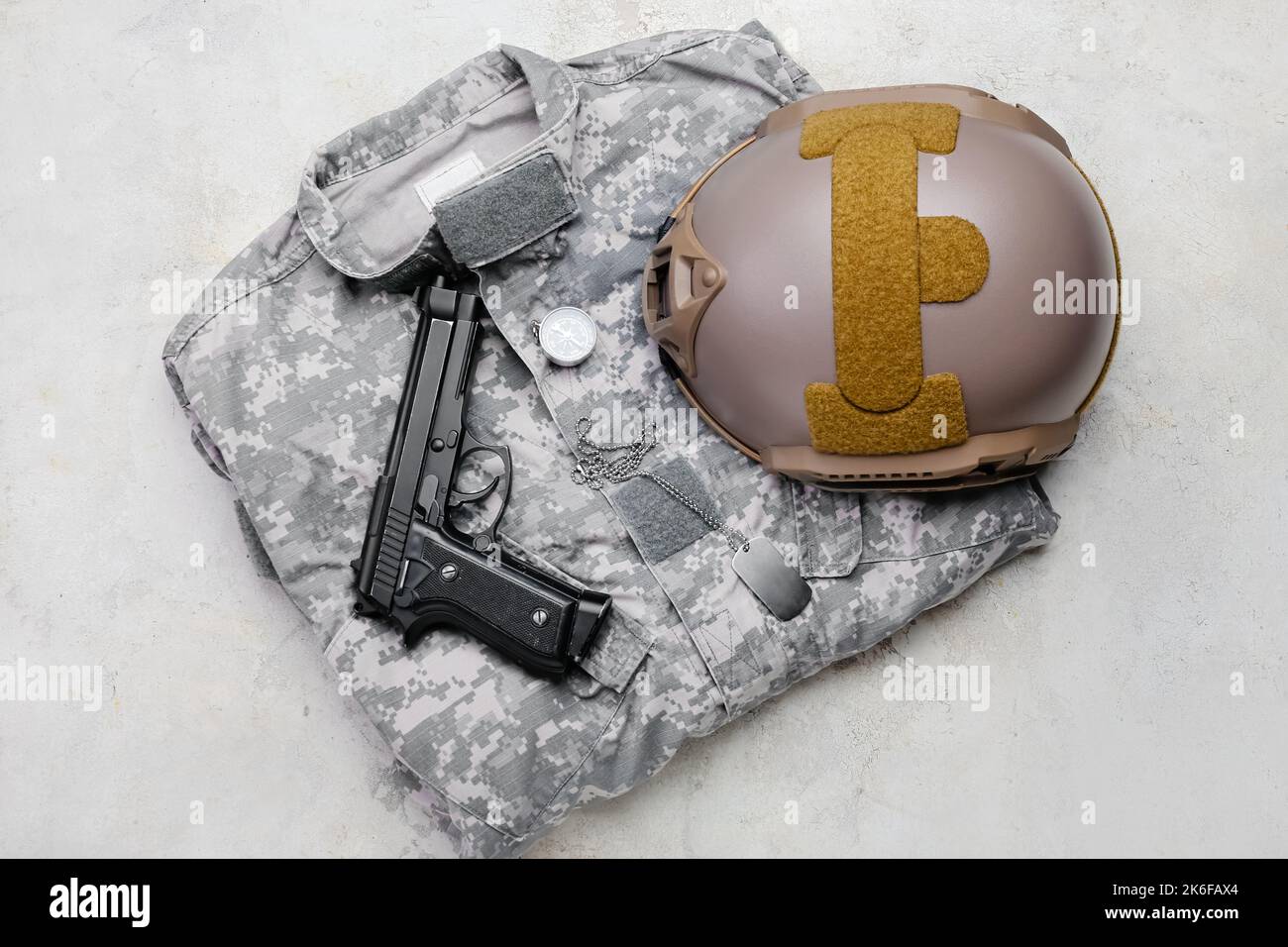Military uniform, helmet, tag and gun on grunge background Stock Photo ...
