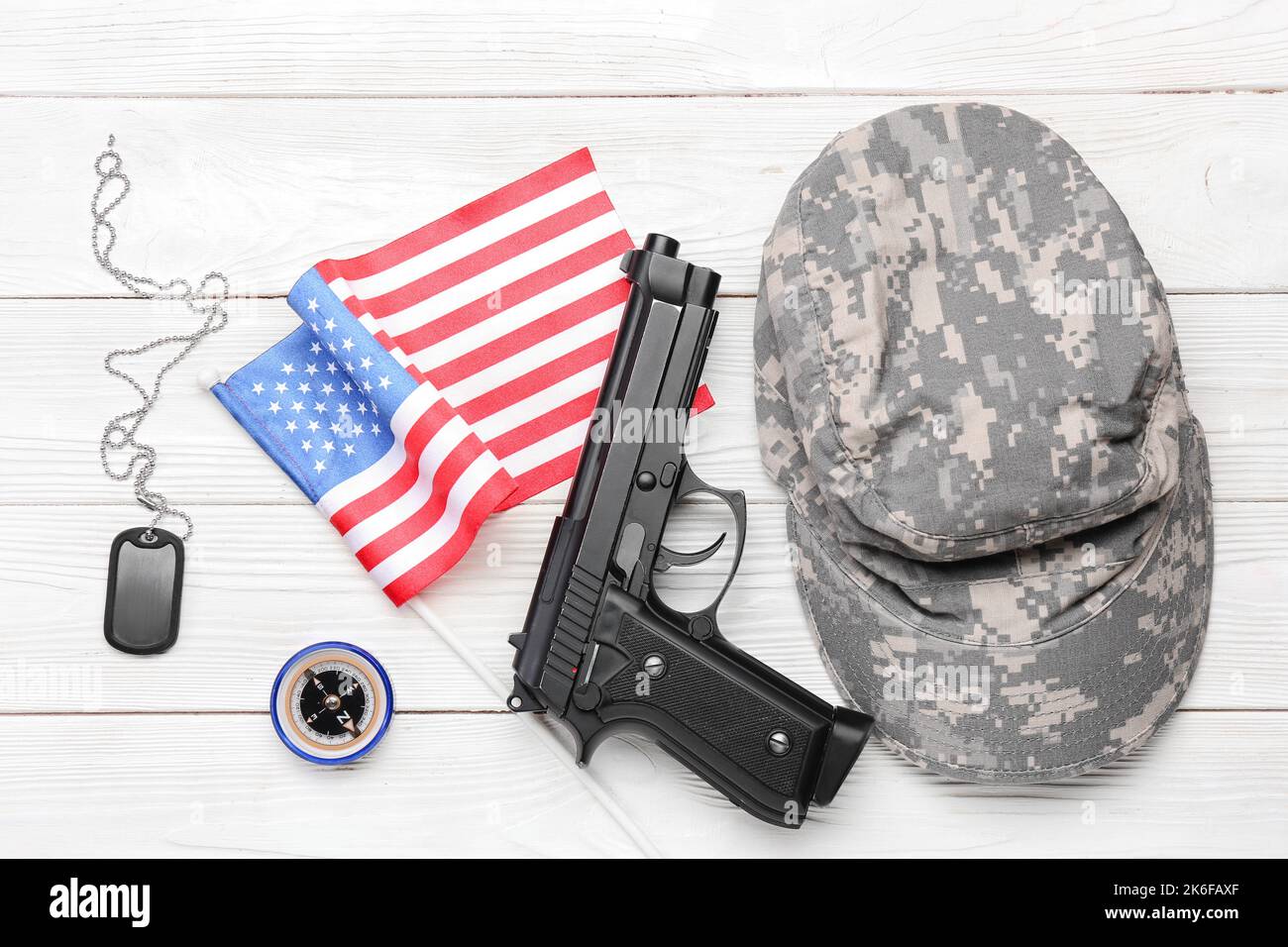 National flag of USA, military cap, gun, compass and tag on white ...