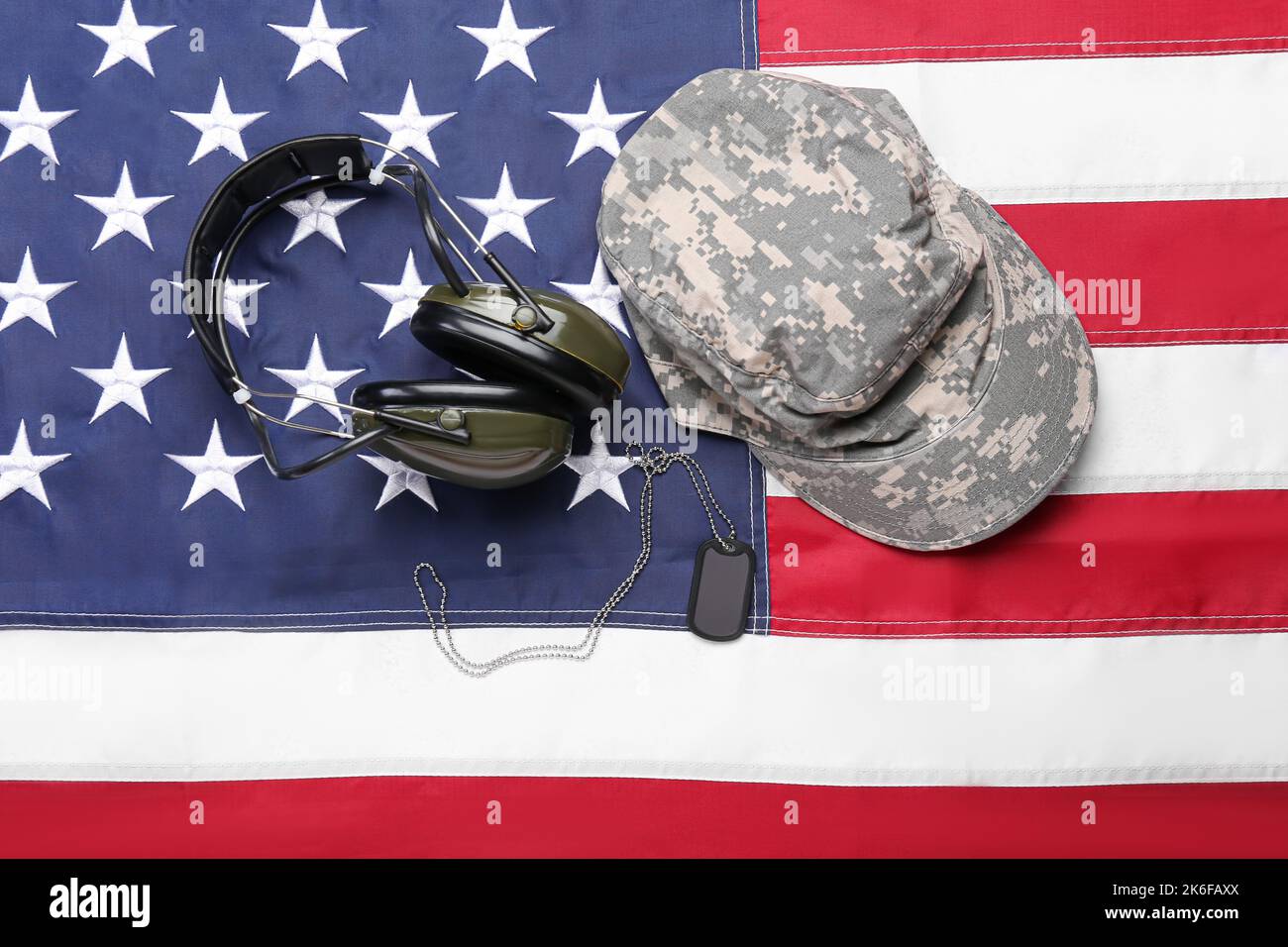 Military cap, tag and headphones on national flag of USA Stock Photo ...