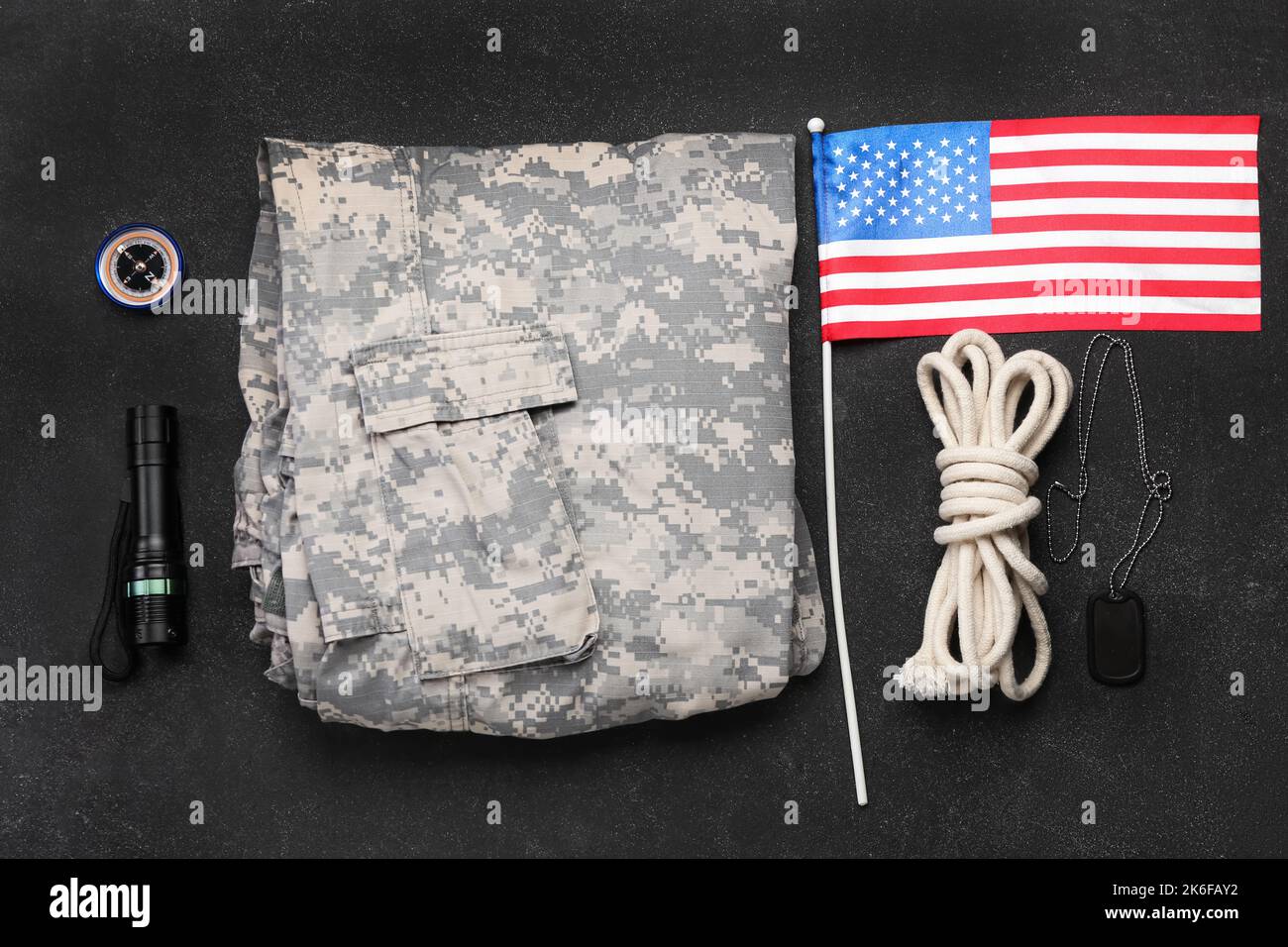 Military uniform, compass, flashlight, rope, tag and national flag of ...