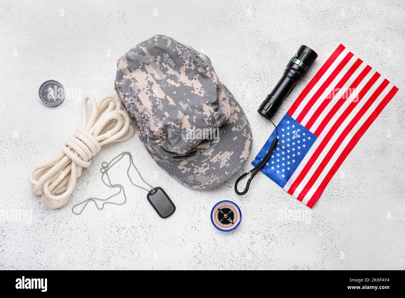 Military cap, compass, tag, flashlight, rope and national flag of USA ...