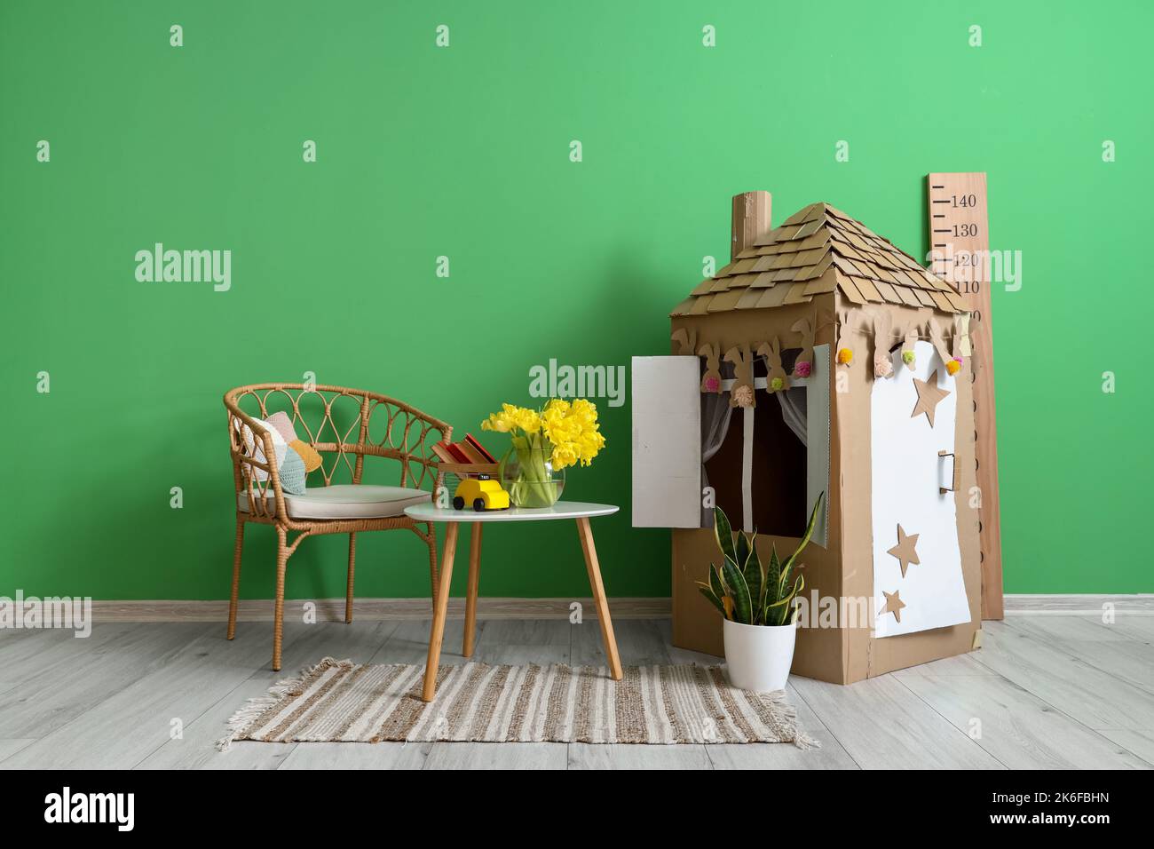 Interior of children's room with cardboard toy house Stock Photo - Alamy