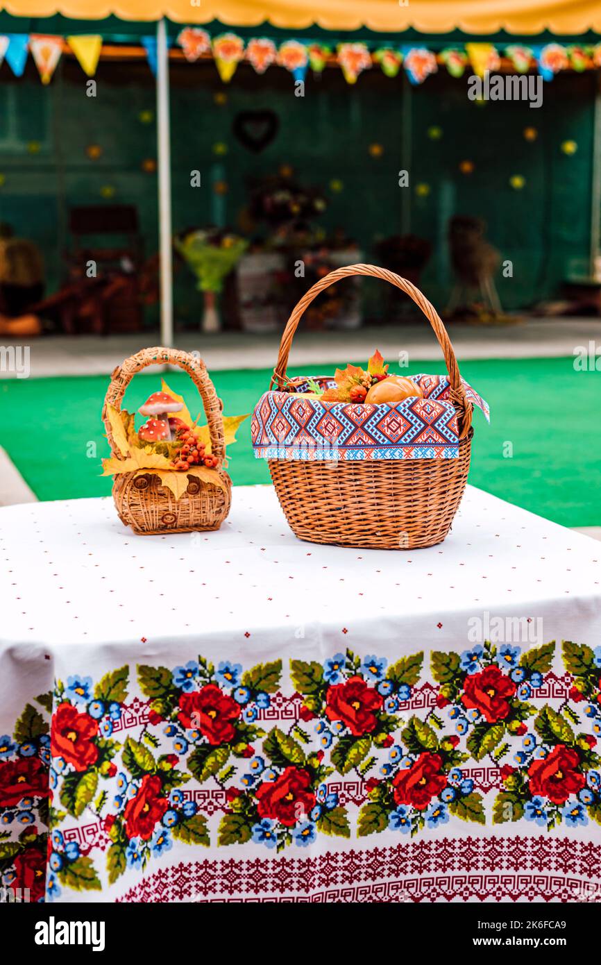 Autumn composition baskets with autumn leaves and berries stand on a ...