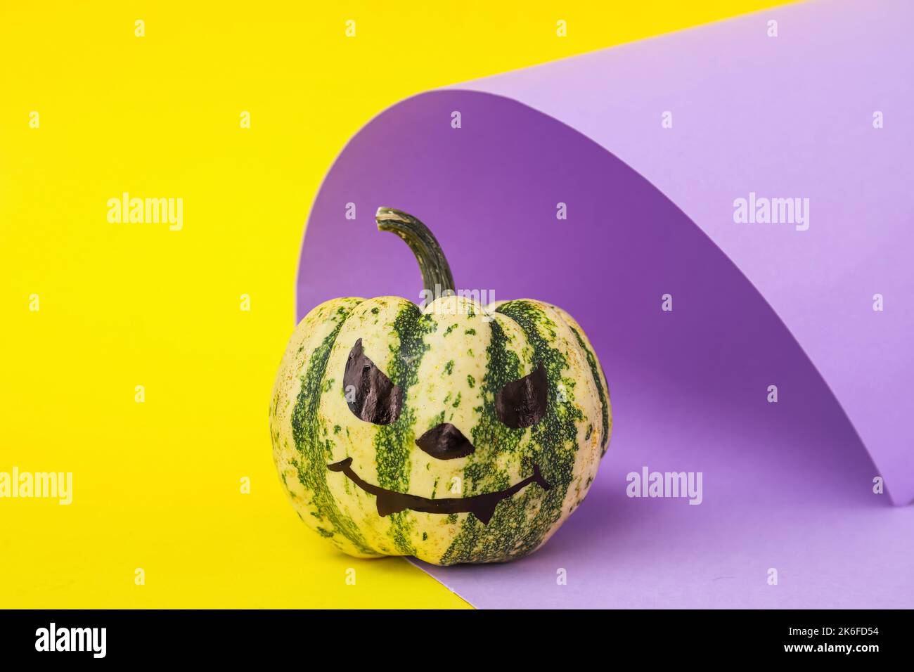 Halloween pumpkin with drawn face on color background Stock Photo - Alamy