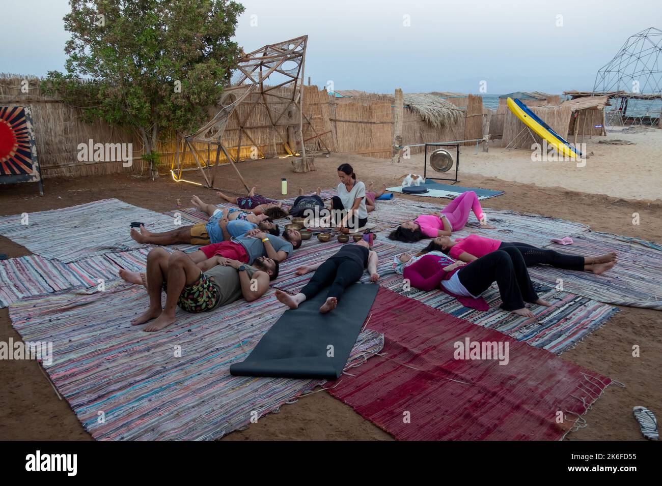 Tourists and Egyptian women practice Yoga in Ras el Satan or Ras ...