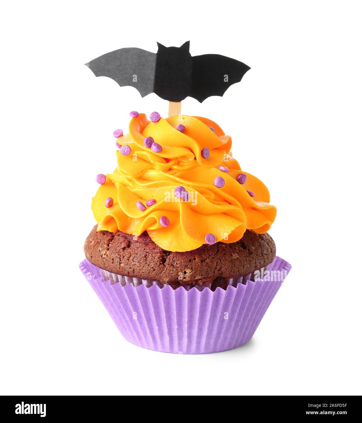 Tasty Halloween cupcake with paper bat on white background Stock Photo ...