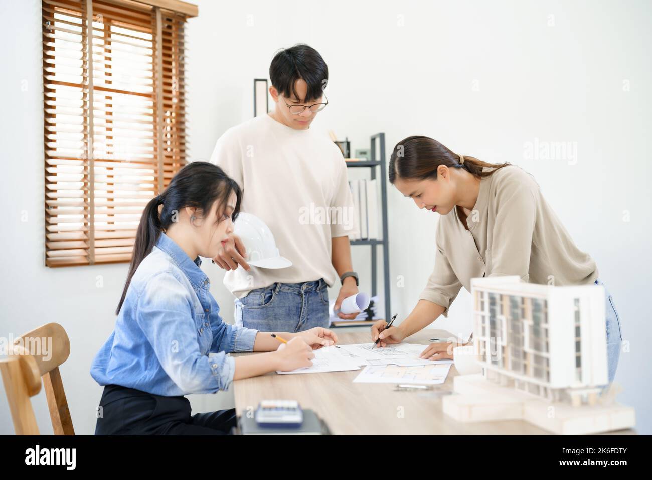 Engineering construction concept, Engineers team point blueprint of ...