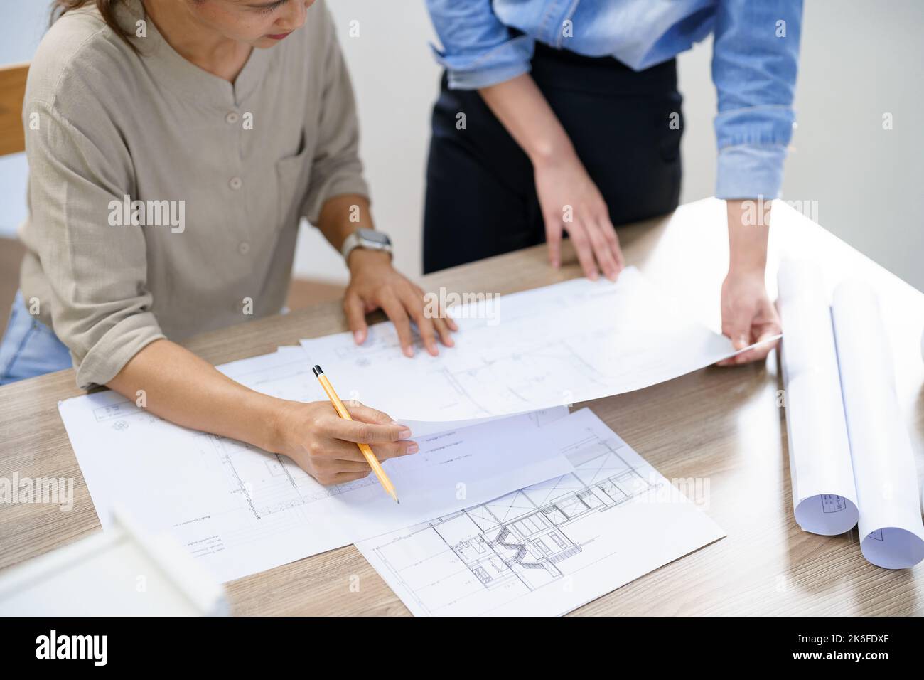 Concept of engineering consulting, Two female engineers brainstorming ...