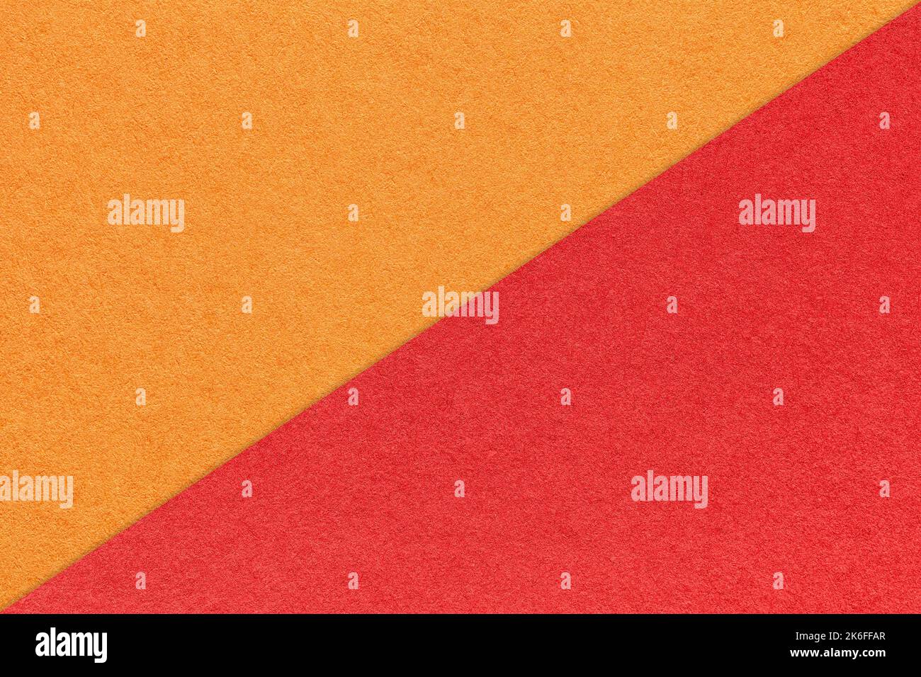 Texture of craft bright orange and red paper background, half two ...