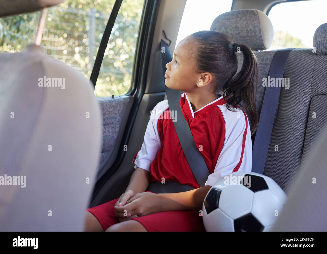 Child in car interior, travel transport to football and soccer athlete ...