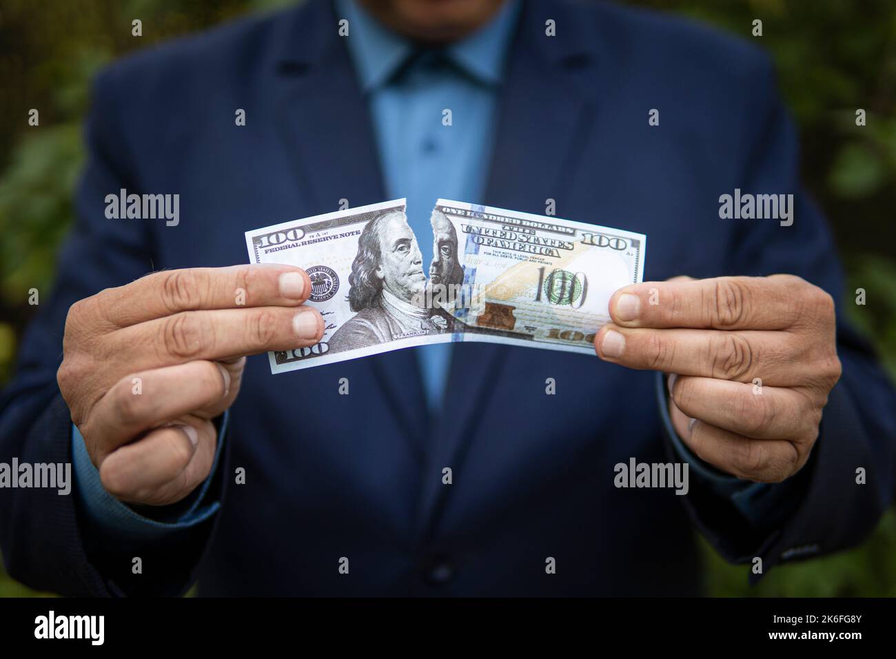 Hands tearing money hi-res stock photography and images - Alamy