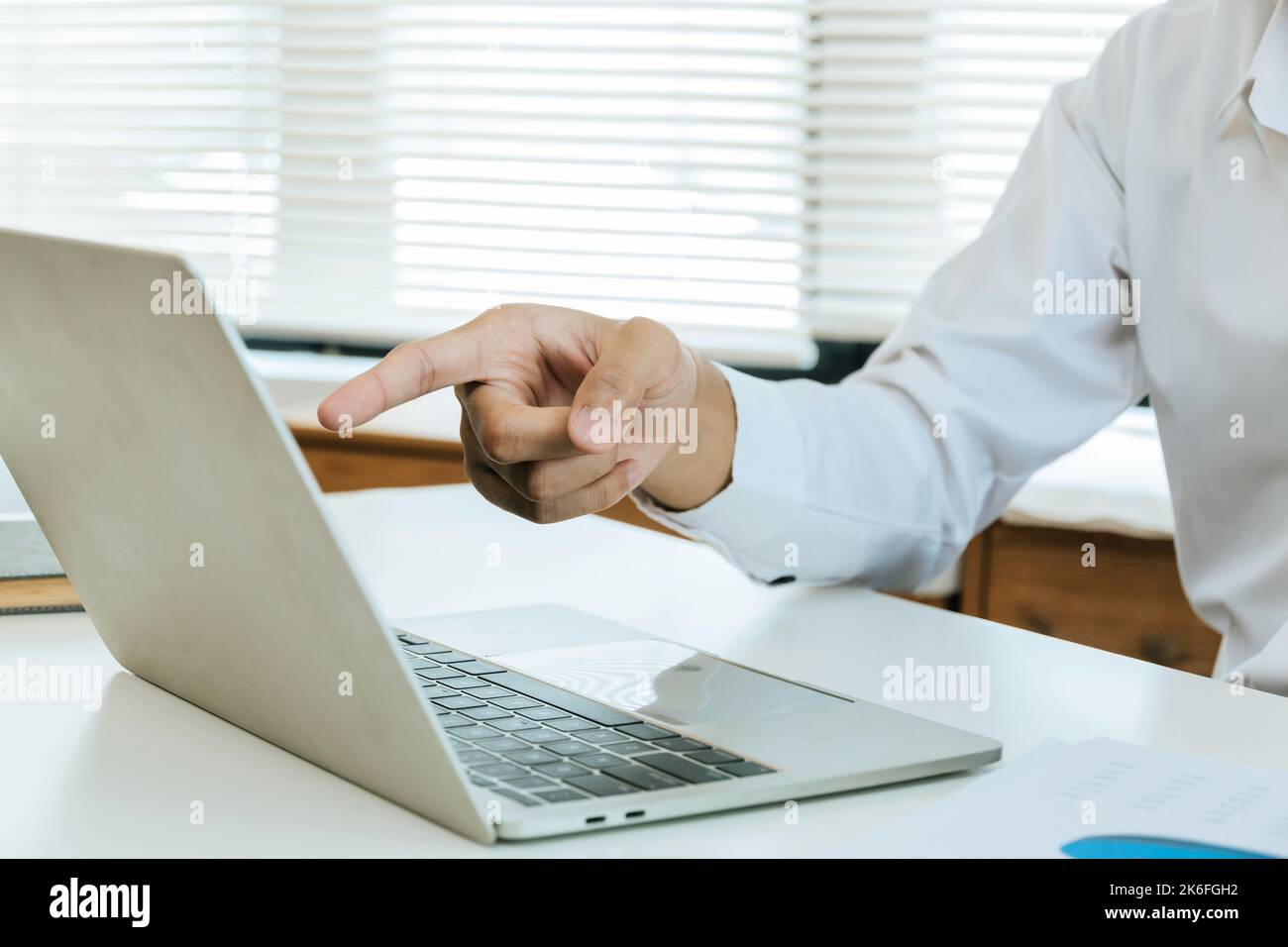business man pointing hand working and calculating about finance ...