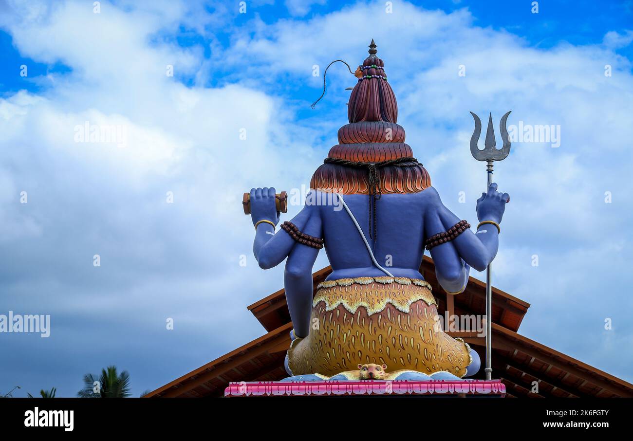 Statue of meditating Hindu god Shiva, an view from backside Stock Photo ...