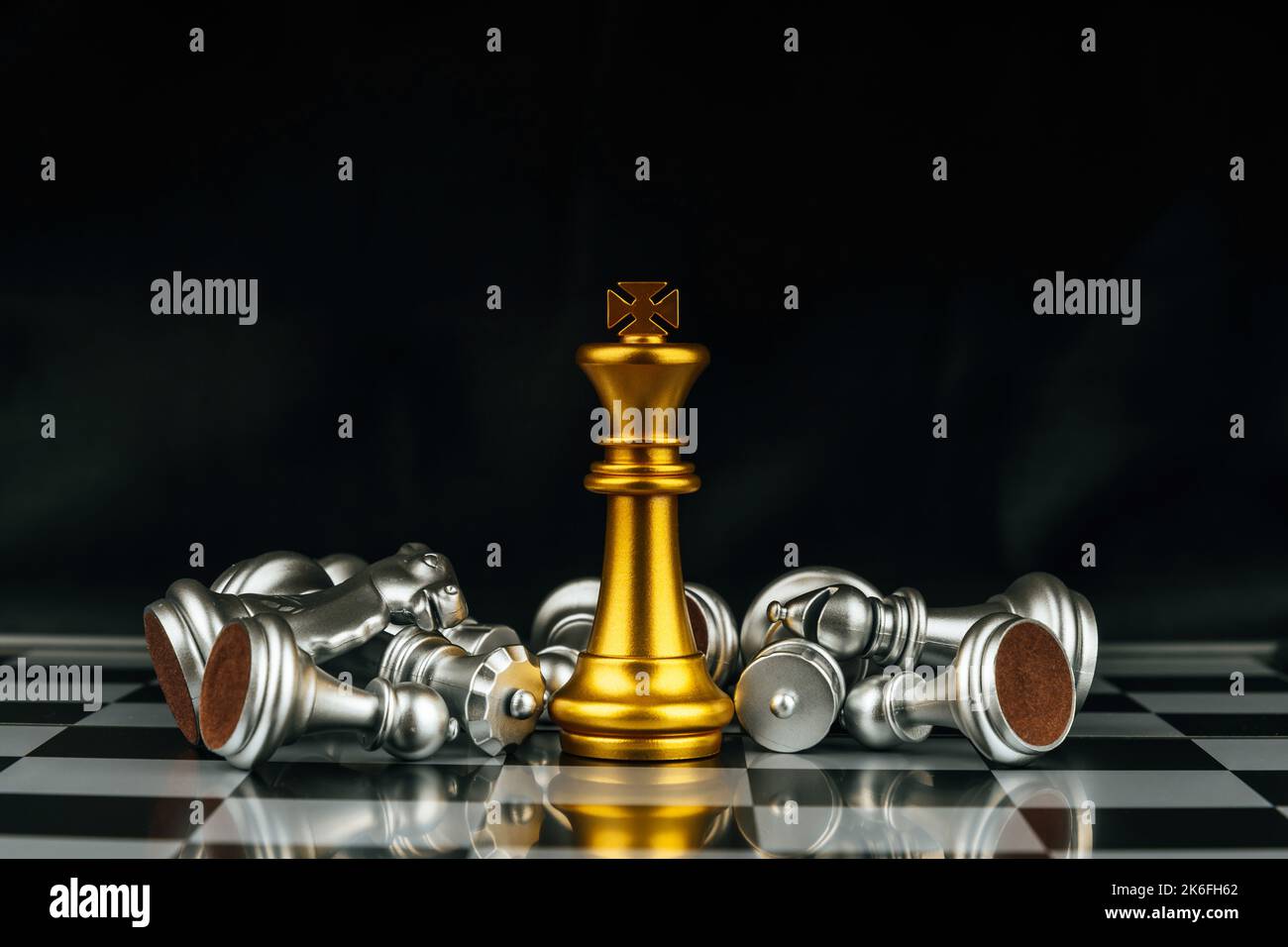 Teamwork. gold and silver chess pieces on chess board game competition ...