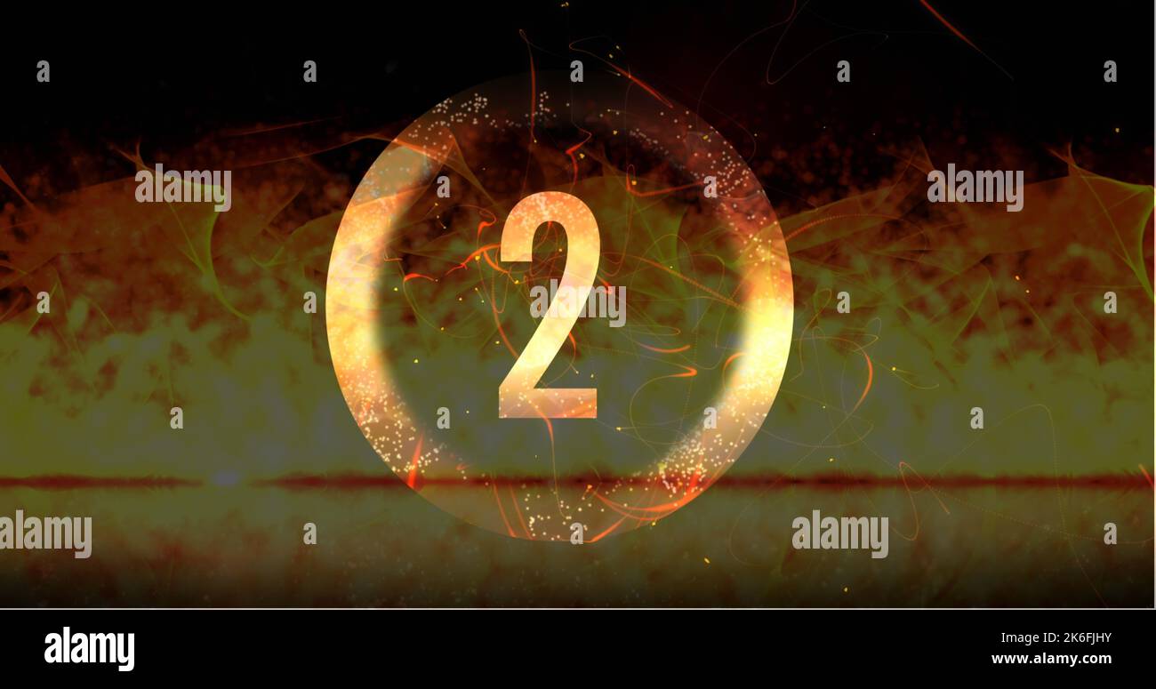 Image of ring and glowing number two in dramatic countdown over flaming ...