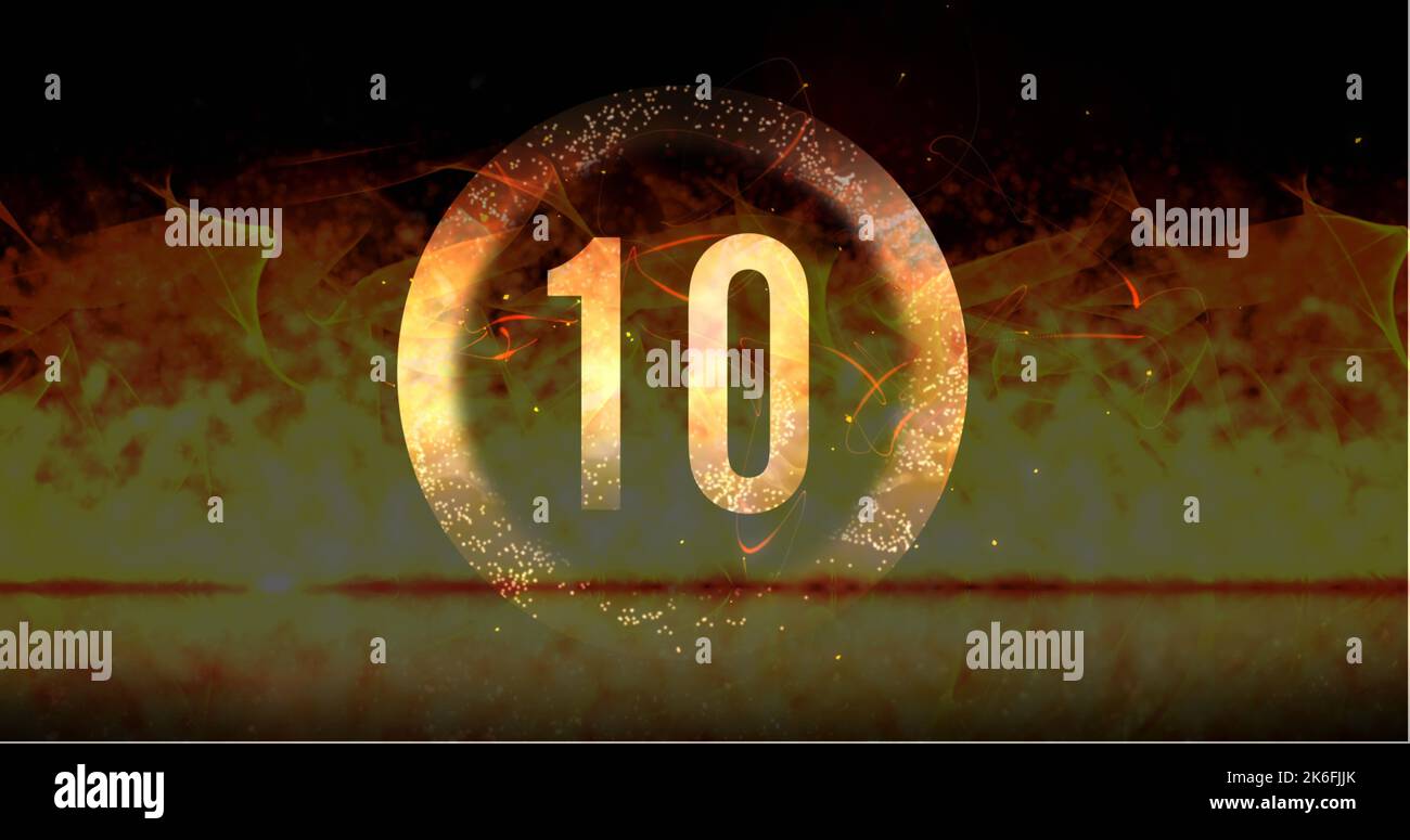 Image of ring and glowing number ten in dramatic countdown over flaming ...