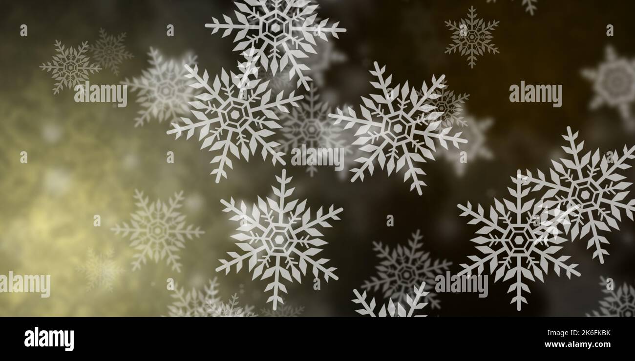 Flying snowflakes over light yellow and gold background Stock Photo - Alamy