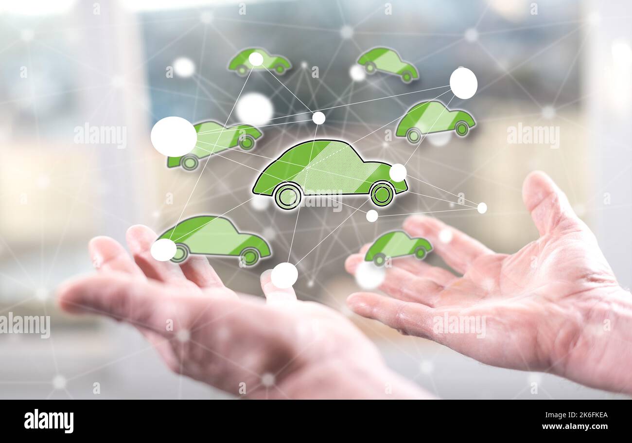 Connected car concept above the hands of a man Stock Photo - Alamy