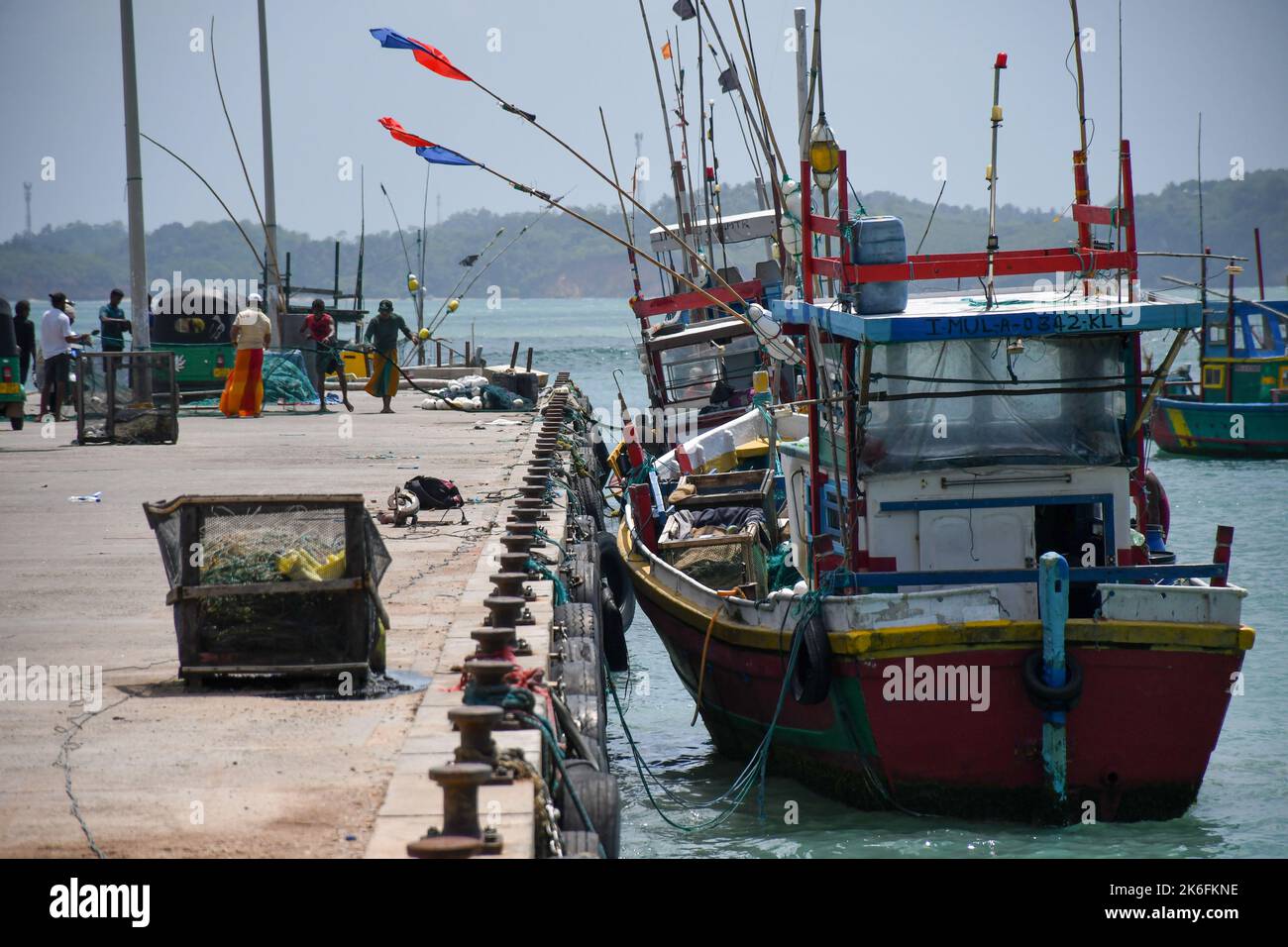 ship is unloading its cargo to the harbour Stock Photo - Alamy