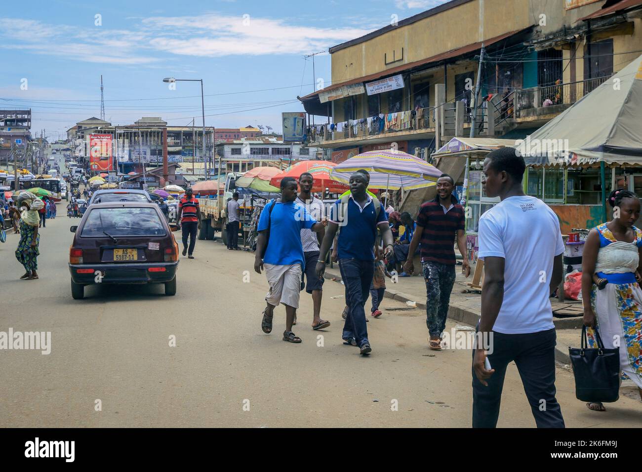 Kumasi, Ghana - April 06, 2022: Local Ghana People crossing the Crowded ...