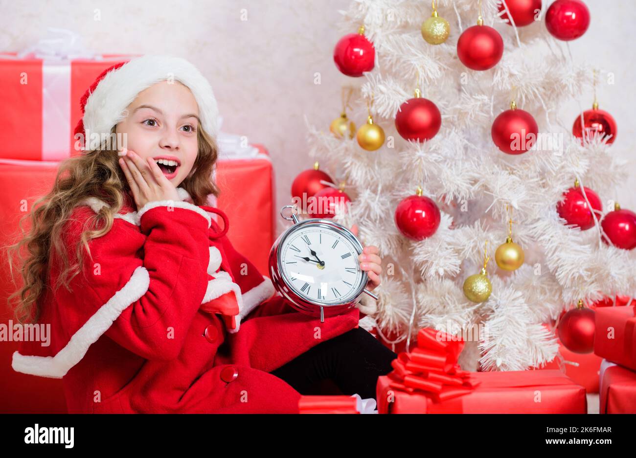 Girl kid santa hat hold clock excited happy face counting time to new ...